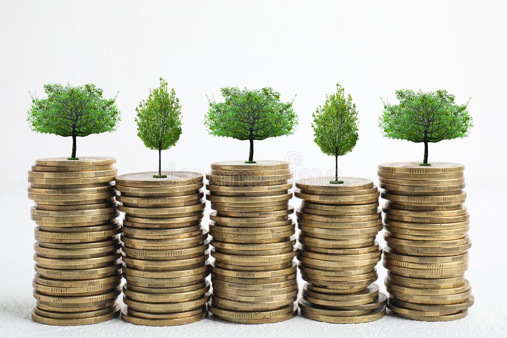 Stacked Coins with Tiny Green Trees on White Background Stock Photo ...