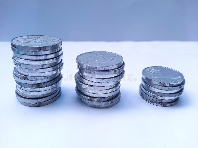 Stacked Coins stock photo. Image of white, currency - 257826864
