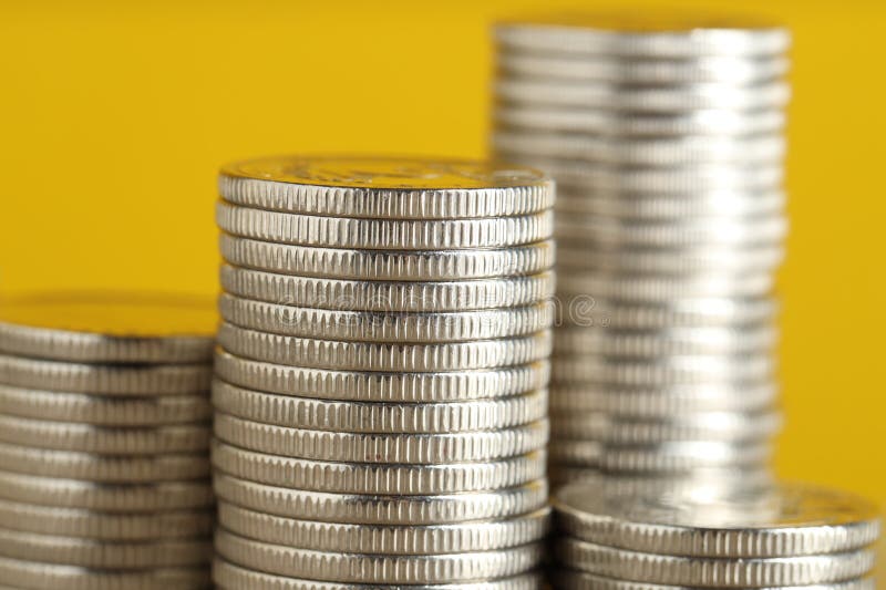 Stacked Coins on Yellow Background, Closeup. Salary Concept Stock Image ...