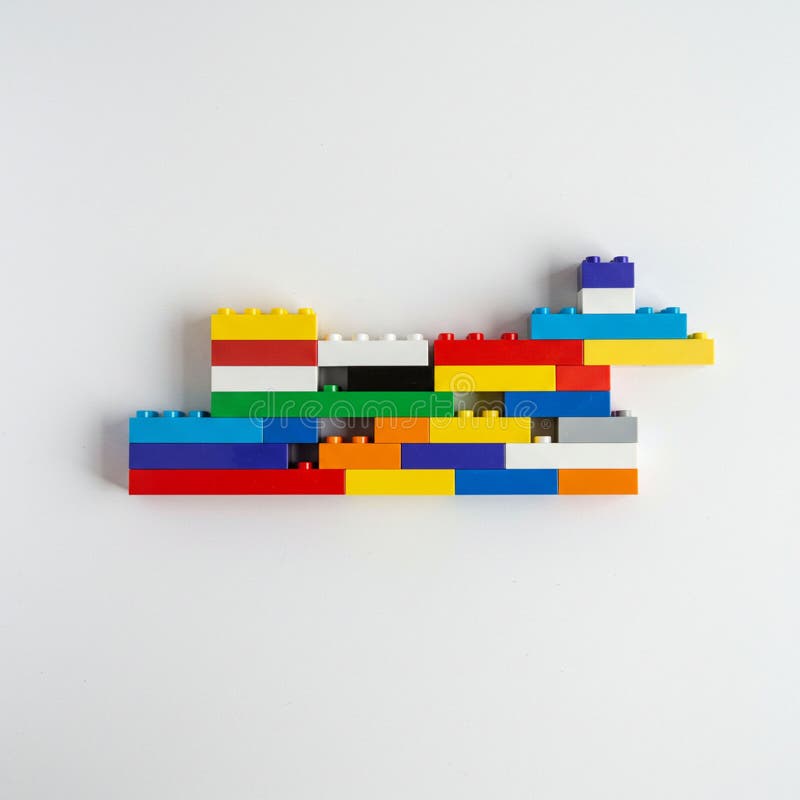 Stacked Colorful Plastic Interlocking Building Blocks on a White ...