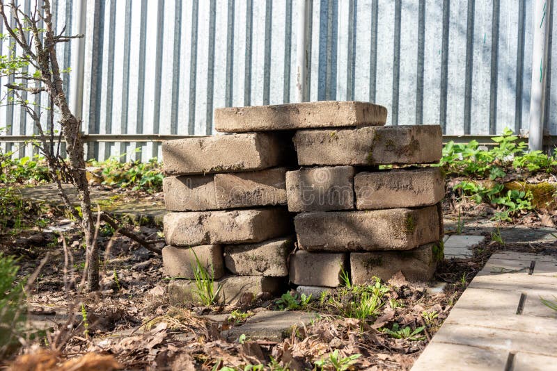Stacked Concrete Slabs by a Young Sapling in Early Spring. Stock Image ...