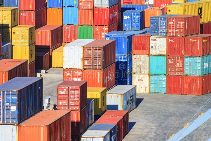 Row of Stacked Containers Cargo Shipping with Container Crane Tractor ...