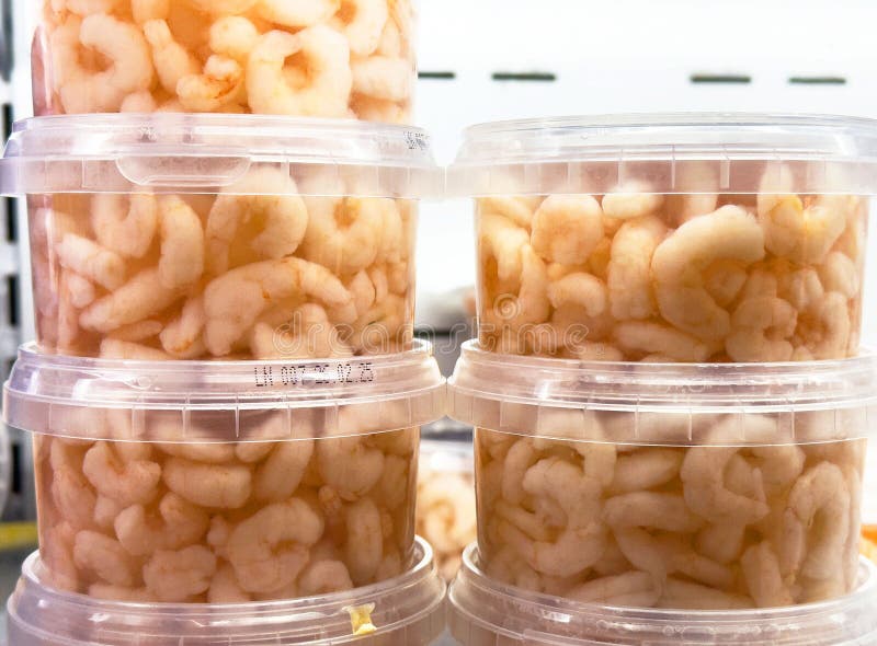 Stacked Containers of Frozen Shrimp in Grocery Store Freezer Section ...