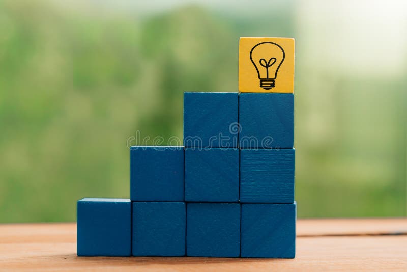 Stacked Cubes with Light Bulb Stock Photo - Image of natural, energy ...