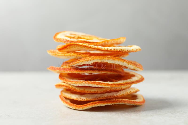 Stacked Dry Orange Slices on White Table Stock Photo - Image of ...