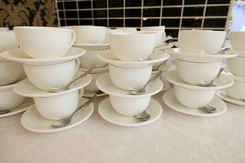 Stacked Empty Teacups with Teaspoons and Plates Stock Image - Image of ...