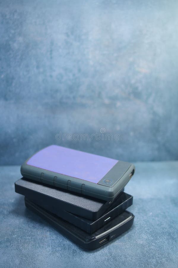 Stacked External Hard Drive on a Table Stock Photo - Image of digital ...