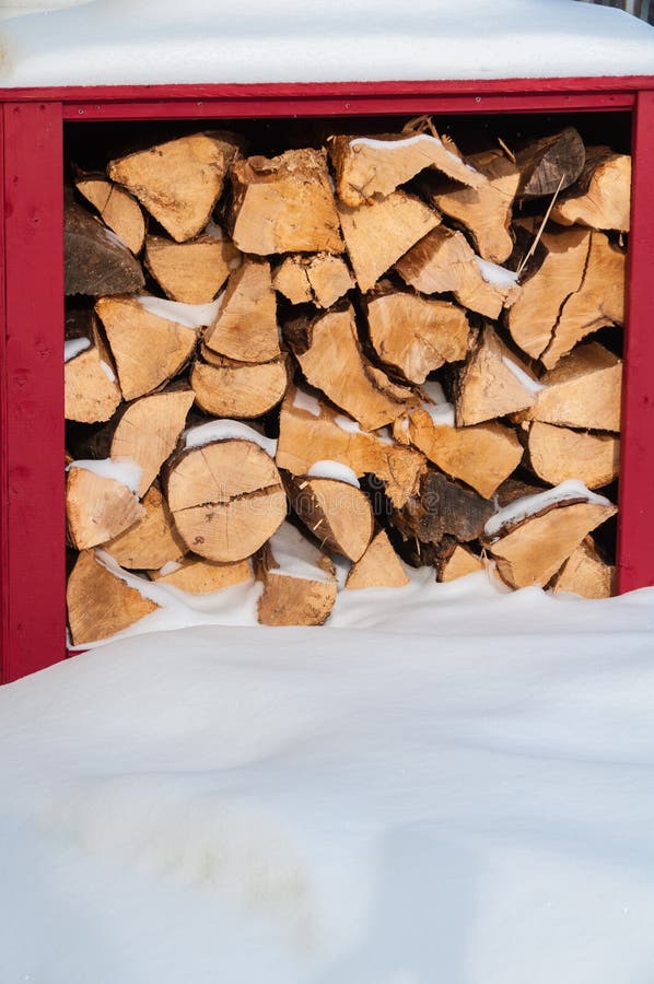 Stacked Firewood in a Red Wood Bin Stock Photo - Image of still, logs ...