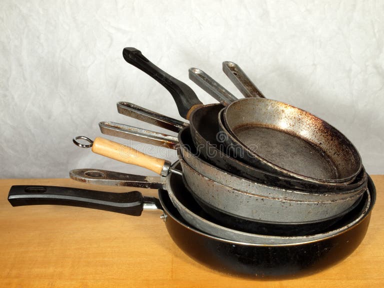 Stacked frying pans stock photo. Image of functional - 15127508