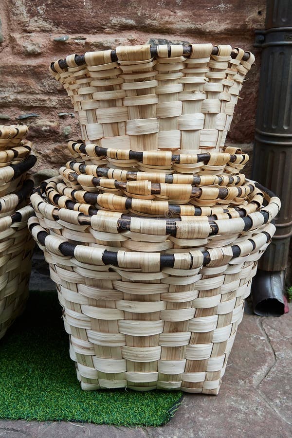 Stacked Handcrafted Wicker Baskets with Intricate Patterns Displayed on ...