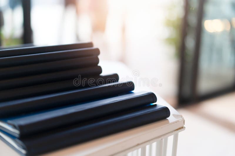 Stacked Menu Book on Table in Restaurant Stock Photo - Image of antique ...