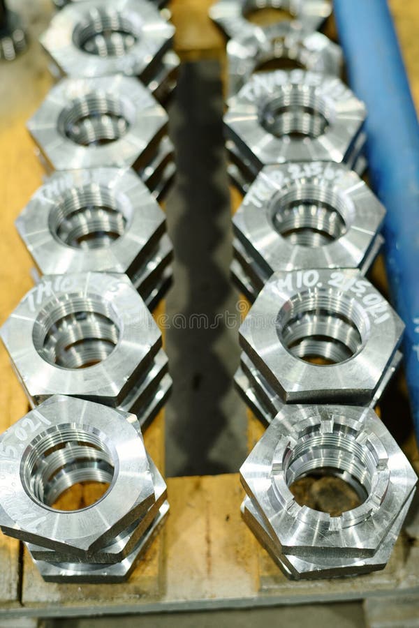 Stacked Metal Hexagonal Nuts on Industrial Workshop Table Stock Photo ...