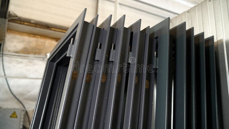Stacked Metal Window Frames with Glass Panes in Workshop Stock Photo ...