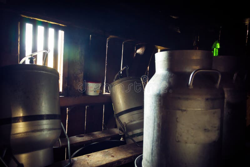 Stacked Milk Cans stock photo. Image of dark, room, horizontal - 95656666