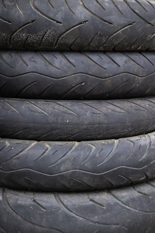 Stacked Motorcycle Tires with Tread Patterns for Enhanced Grip and ...