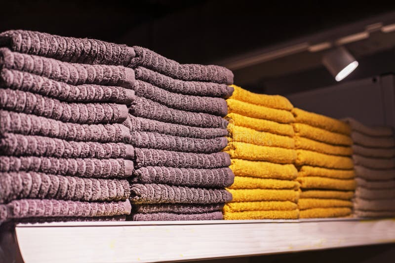 Stacked Multi-colored Bath Towels on a Shelf. Stock Photo - Image of ...