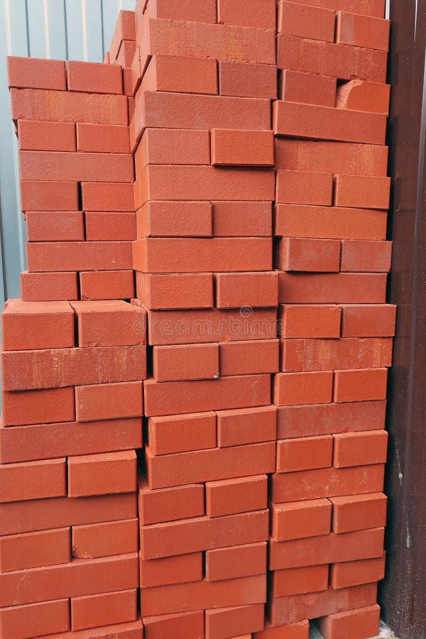 Stacked Orange Bricks at a Construction Site Stock Image - Image of ...