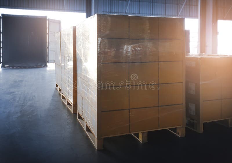 Stacked of Package Boxes Load into Cargo Container. Truck Parked ...