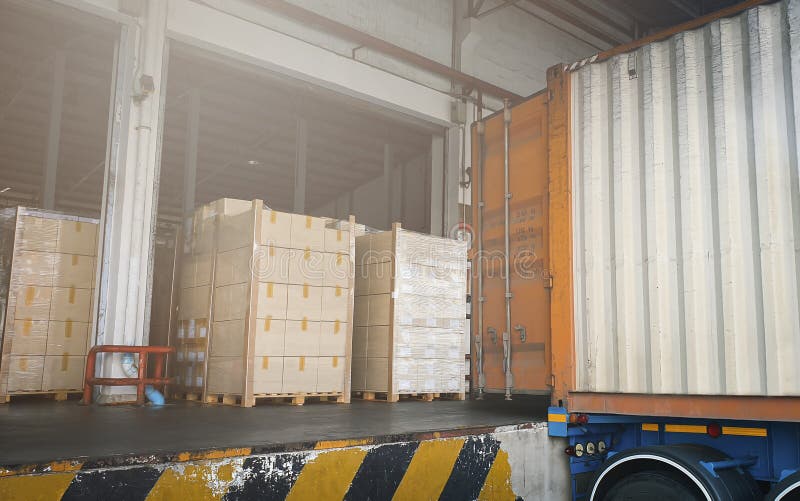 Stacked of Package Boxes on Pallet with Cargo Container. Trailer Parked ...