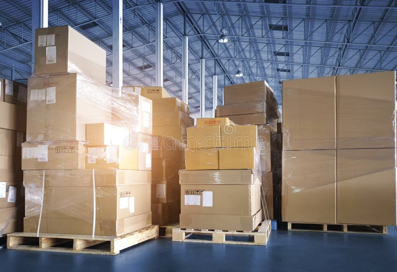 Stacked of Package Boxes on Wooden Pallet at Storage Warehouse ...