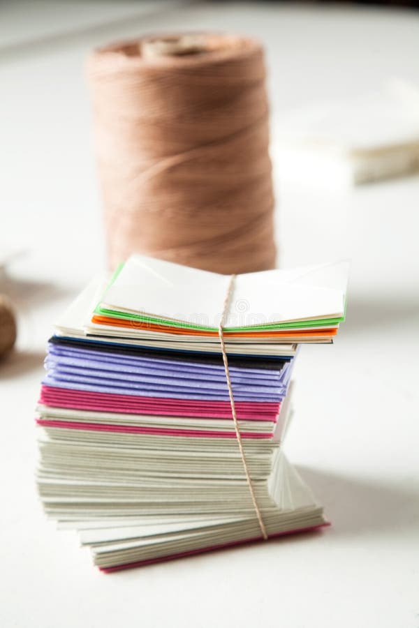 Stacked Papers and Thread on Table Stock Image - Image of factories ...