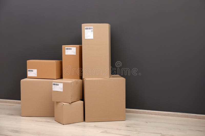 Stacked Parcel Boxes on Floor Against Wall Stock Image - Image of gift ...
