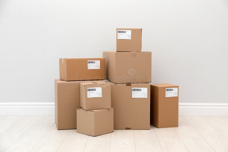 Stacked Parcel Boxes on Floor Stock Photo - Image of boxes, gift: 129848198