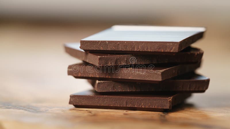 Stacked Pieces of Chocolate Bar on Wooden Table Stock Photo - Image of ...