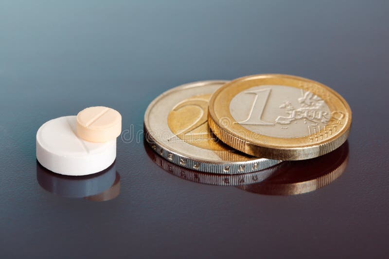 Stacked Pills Near Pair of Euro Coins Stock Photo - Image of ...
