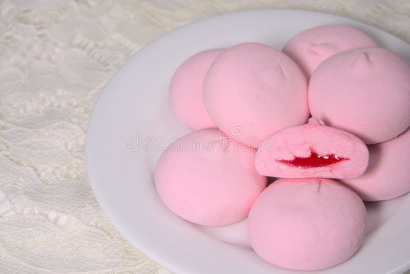 Stacked Pink Buns in a White Porcelain Plate on the Table Stock Photo ...