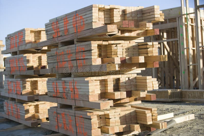 Stacked of Planks at Construction Site Stock Photo - Image of area ...