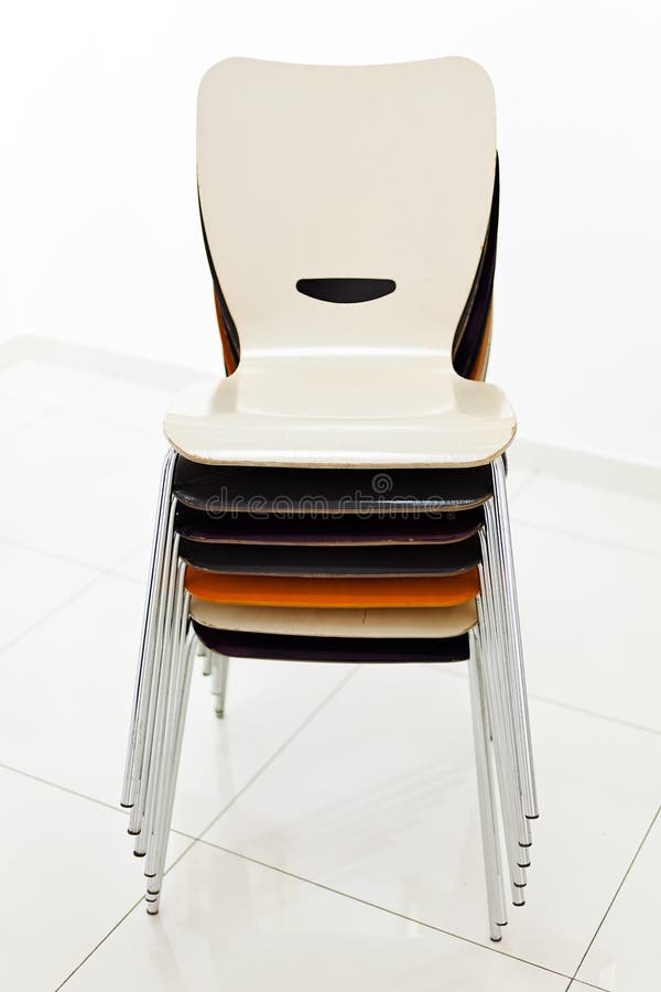 Stacked plastic chairs stock photo. Image of design, meeting - 72837102