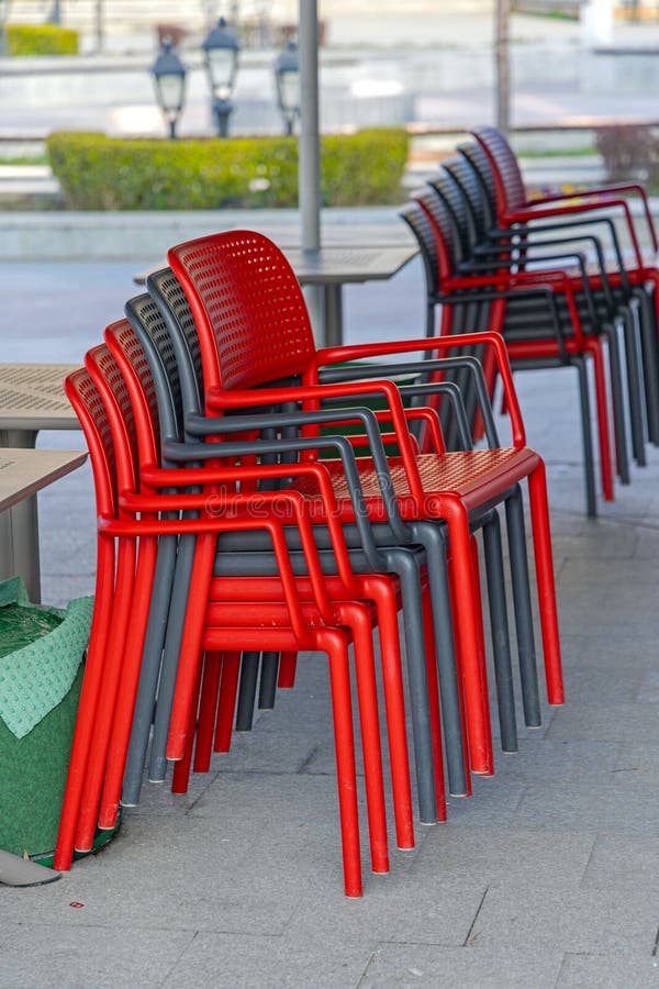 Stacked Plastic Chairs stock photo. Image of coffee - 335997020