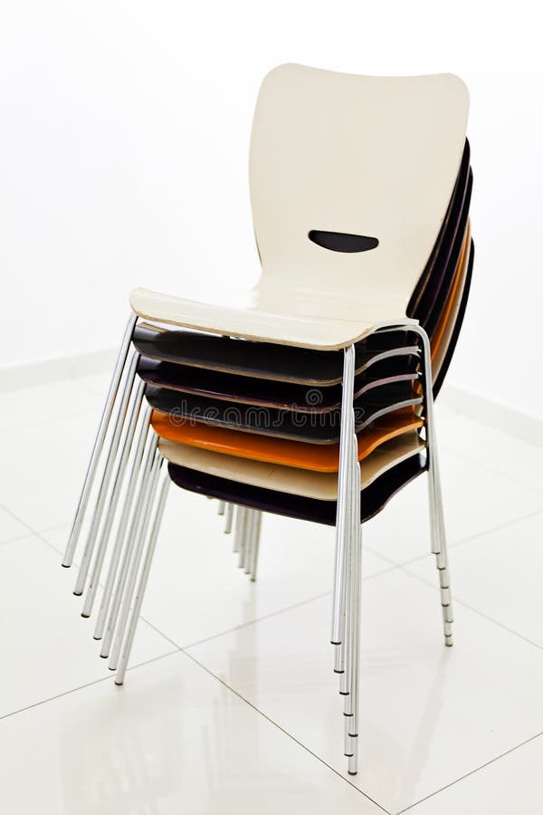 Stacked plastic chairs stock image. Image of seat, orange - 72837485