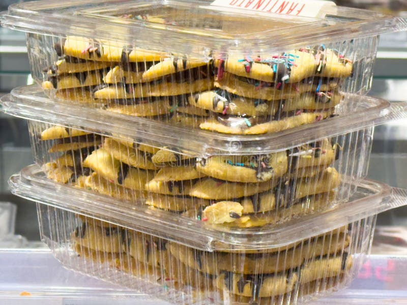 Stacked Plastic Containers of Sprinkle-topped Cookies in a Bakery ...