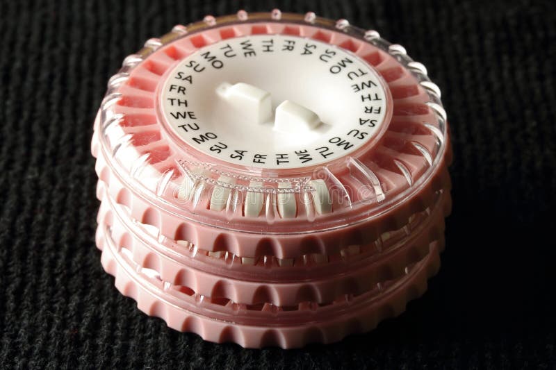 STACKED PLASTIC TABLET DISPENSERS MARKED in CALENDER DAYS for a MONTH ...