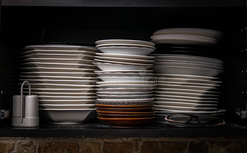 Stacked Plates in Kitchen Cabinet Stock Image - Image of meal, white ...