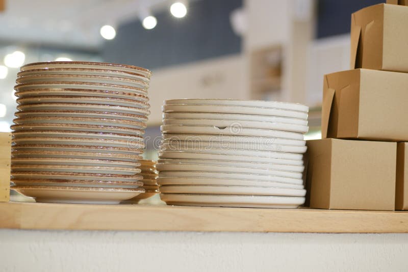Stacked Plates and Takeout Boxes in Modern Caf Setting Stock Image ...