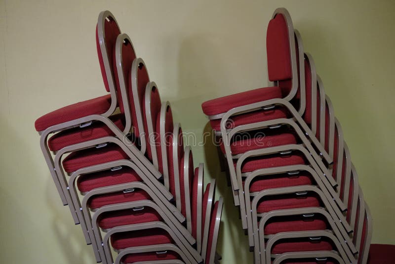 Stacked red chairs stock image. Image of color, bright - 108163041