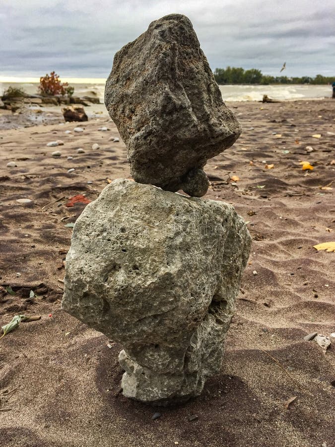 Stacked Rock Sculpture on a Beach Stock Photo - Image of trees, beach ...