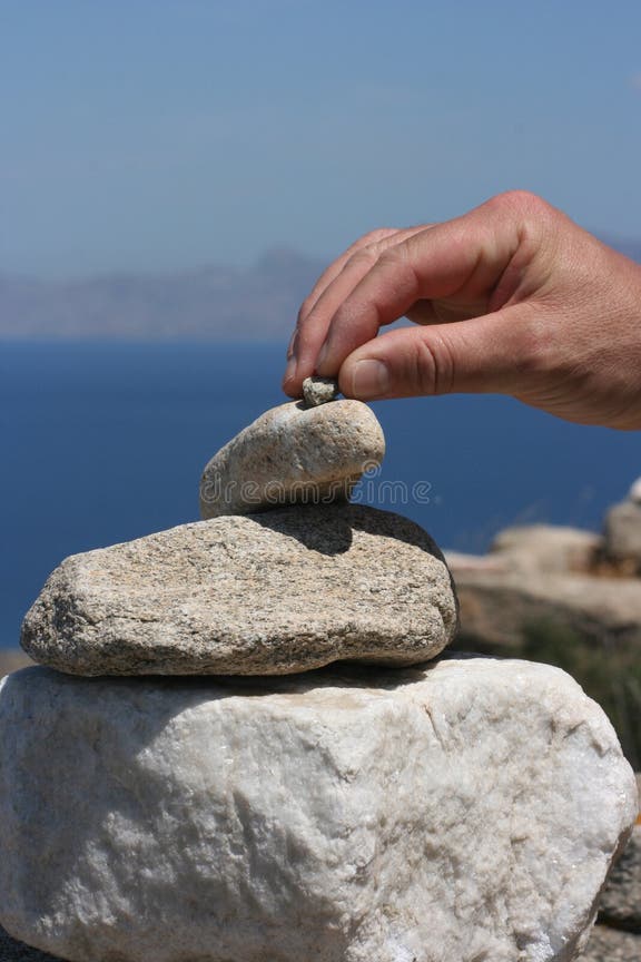 Stacked rocks stock photo. Image of rocks, hand, stacking - 12469526