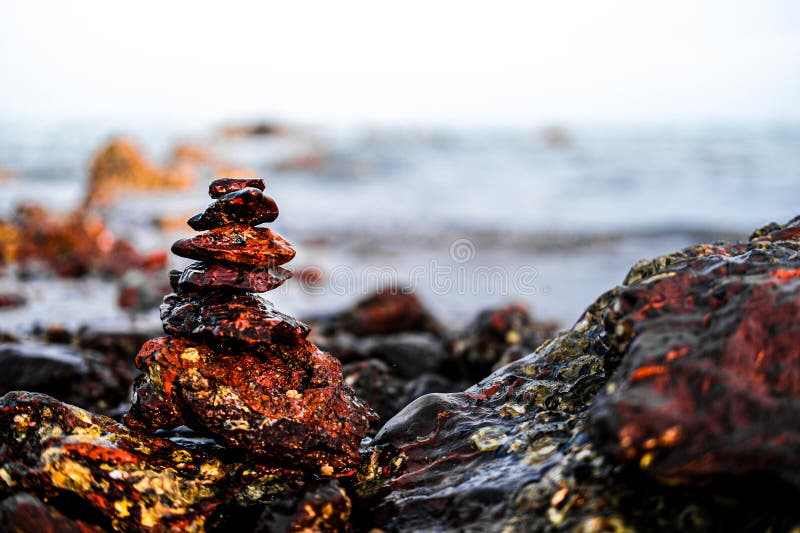 Stacked rocks on the beach stock photo. Image of rocks - 338170808