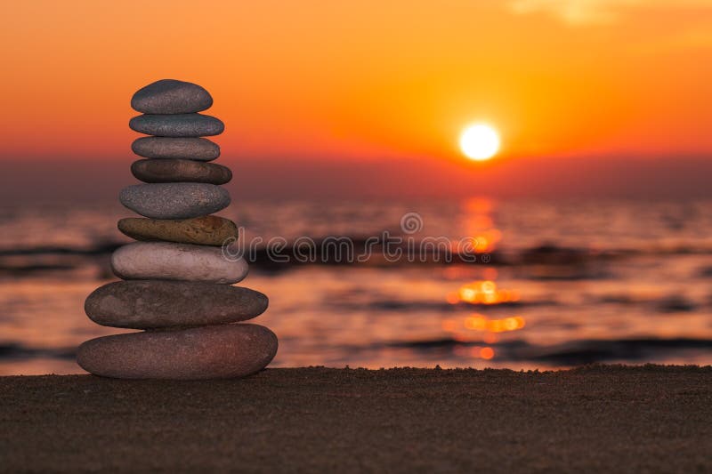 Stacked Rocks on the Beach with a Sunset Ocean Stock Image - Image of ...