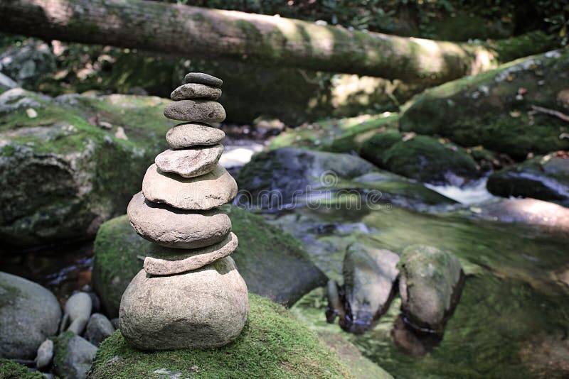 Stacked Rocks on Side of Mountain Stream Stock Photo - Image of ...