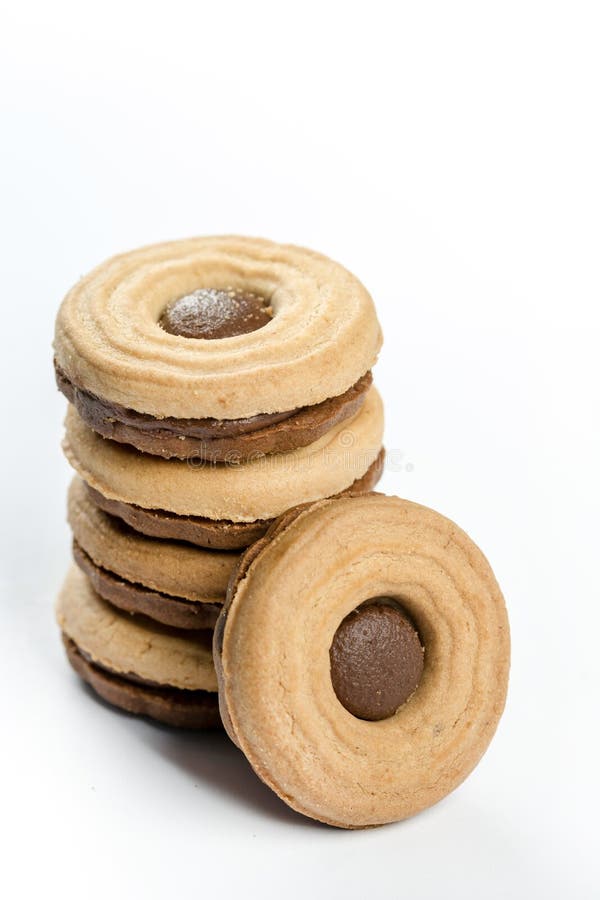 Stacked Round Biscuits Topped with Chocolate Cream Over White ...