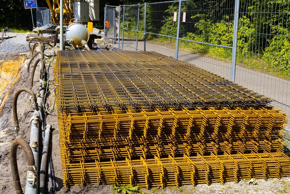 Stacked Rust-colored Reinforcement Mesh on a Construction Site Stock ...