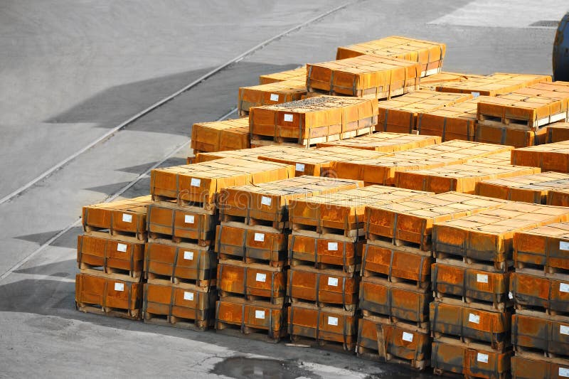 Rusty rolled metal in port stock image. Image of piled - 108347645