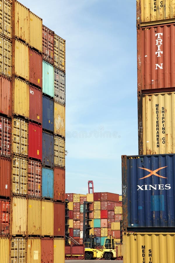 Stacked Shipping Containers and Empty Container Handler Editorial Stock ...