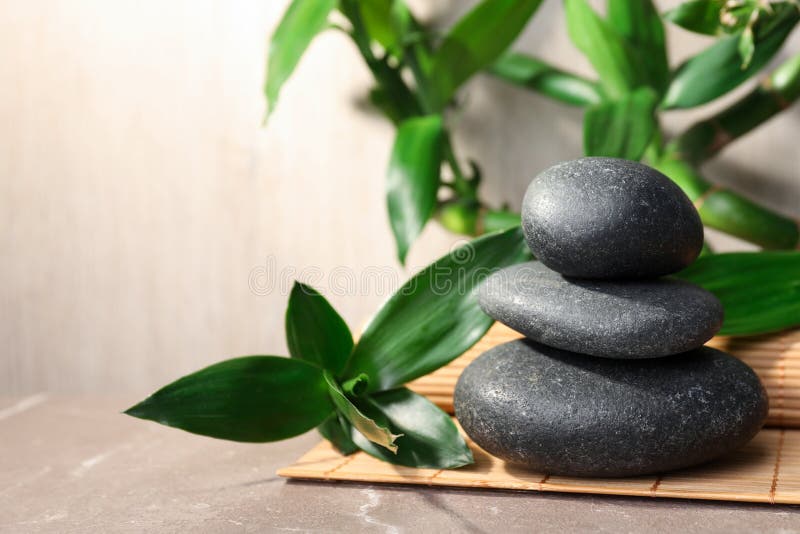 Stacked Spa Stones and Bamboo on Mat. Space for Text Stock Image ...