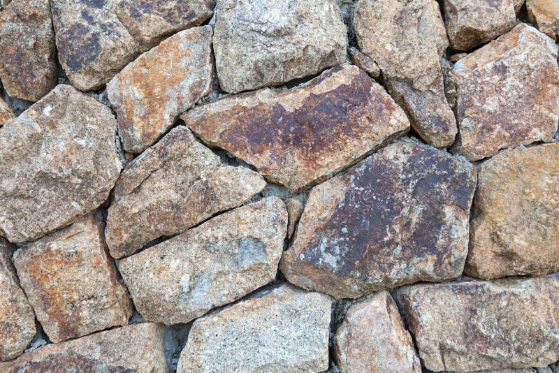 Stacked stone wall. stock photo. Image of facade, brown - 61630228